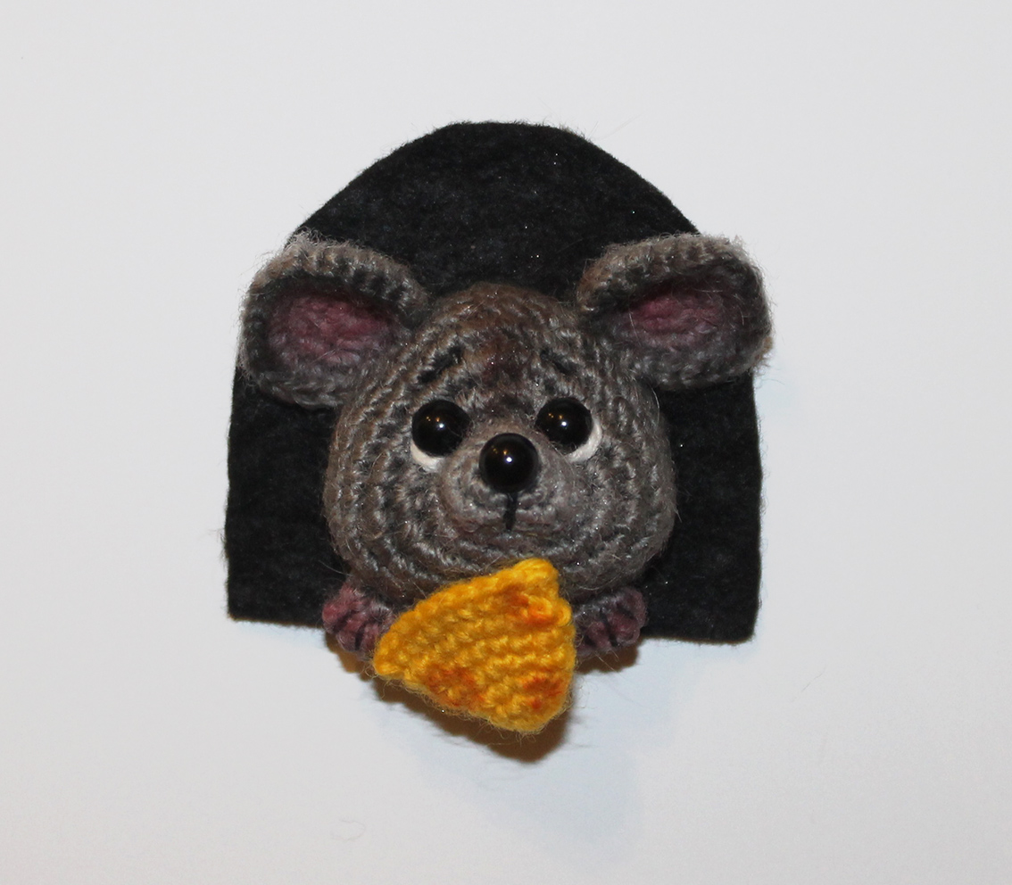 The mouse thief. A magnet on the fridge.