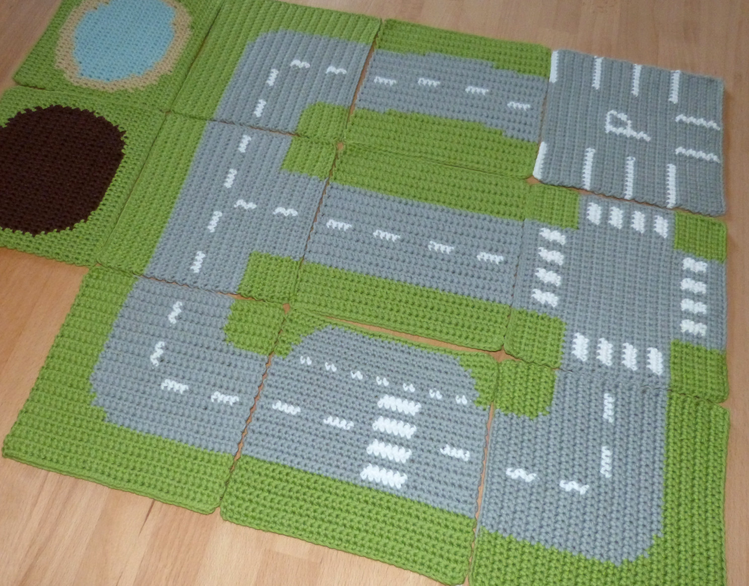 Crochet pattern for a play mat with a street map of 9 different tiles